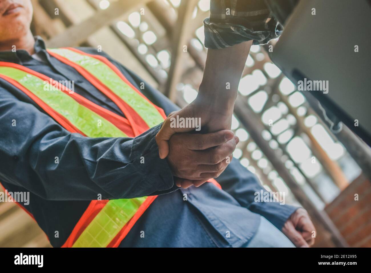 Shake hand concept, two engineer shake hand on site construction to ...