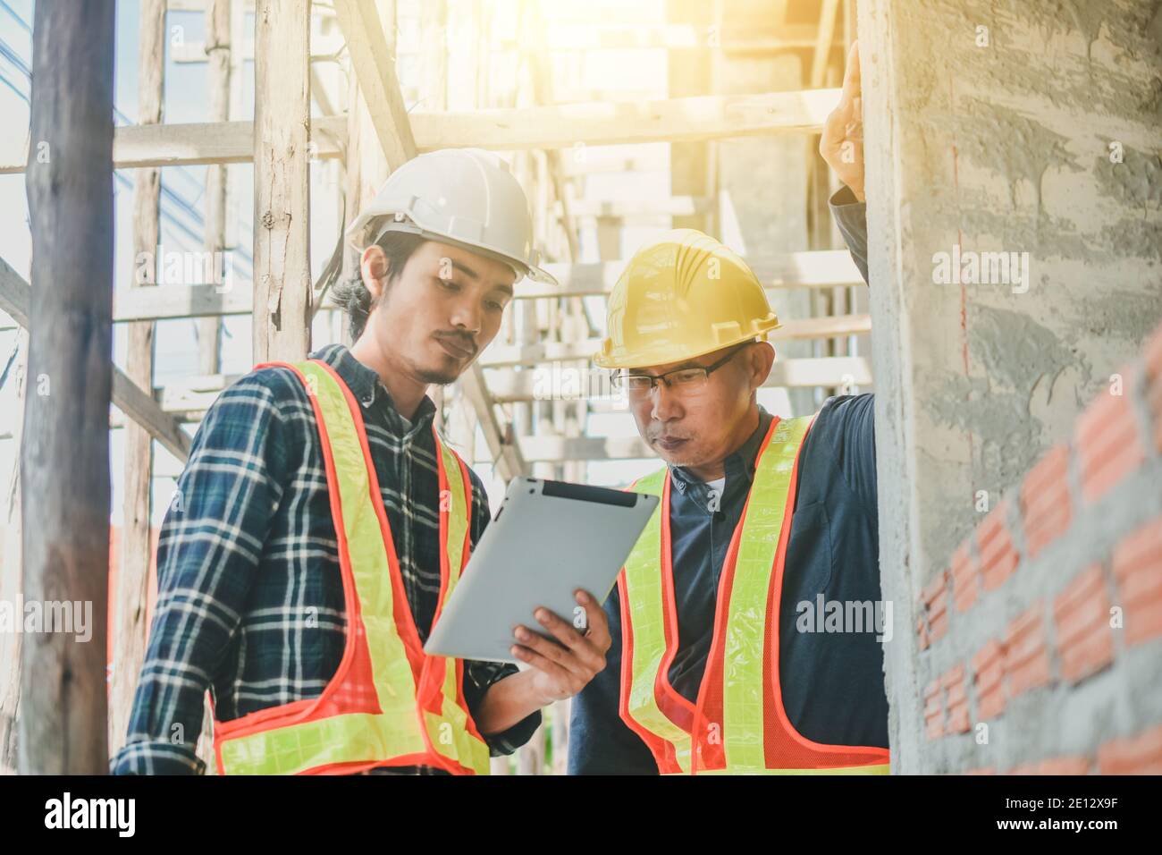 Two engineer worker work in construction site, Engineer inspector on ...