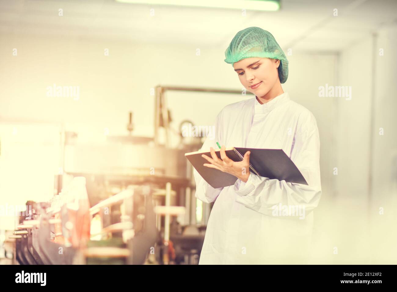 Women inspection quality control in beverage factory Stock Photo - Alamy