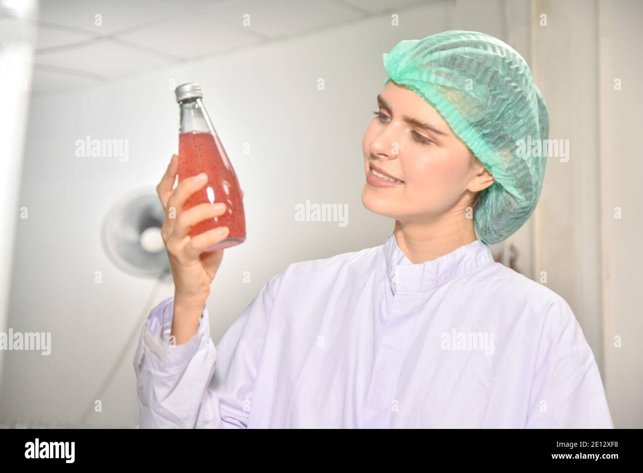 Women inspection quality control in beverage factory Stock Photo - Alamy