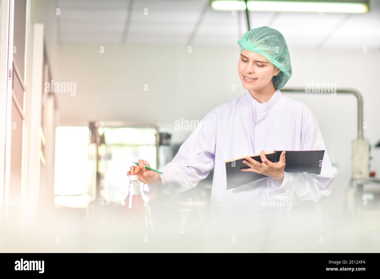 Women inspection quality control in beverage factory Stock Photo - Alamy