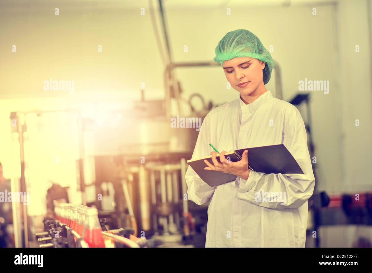 Women inspection quality control in beverage factory Stock Photo - Alamy