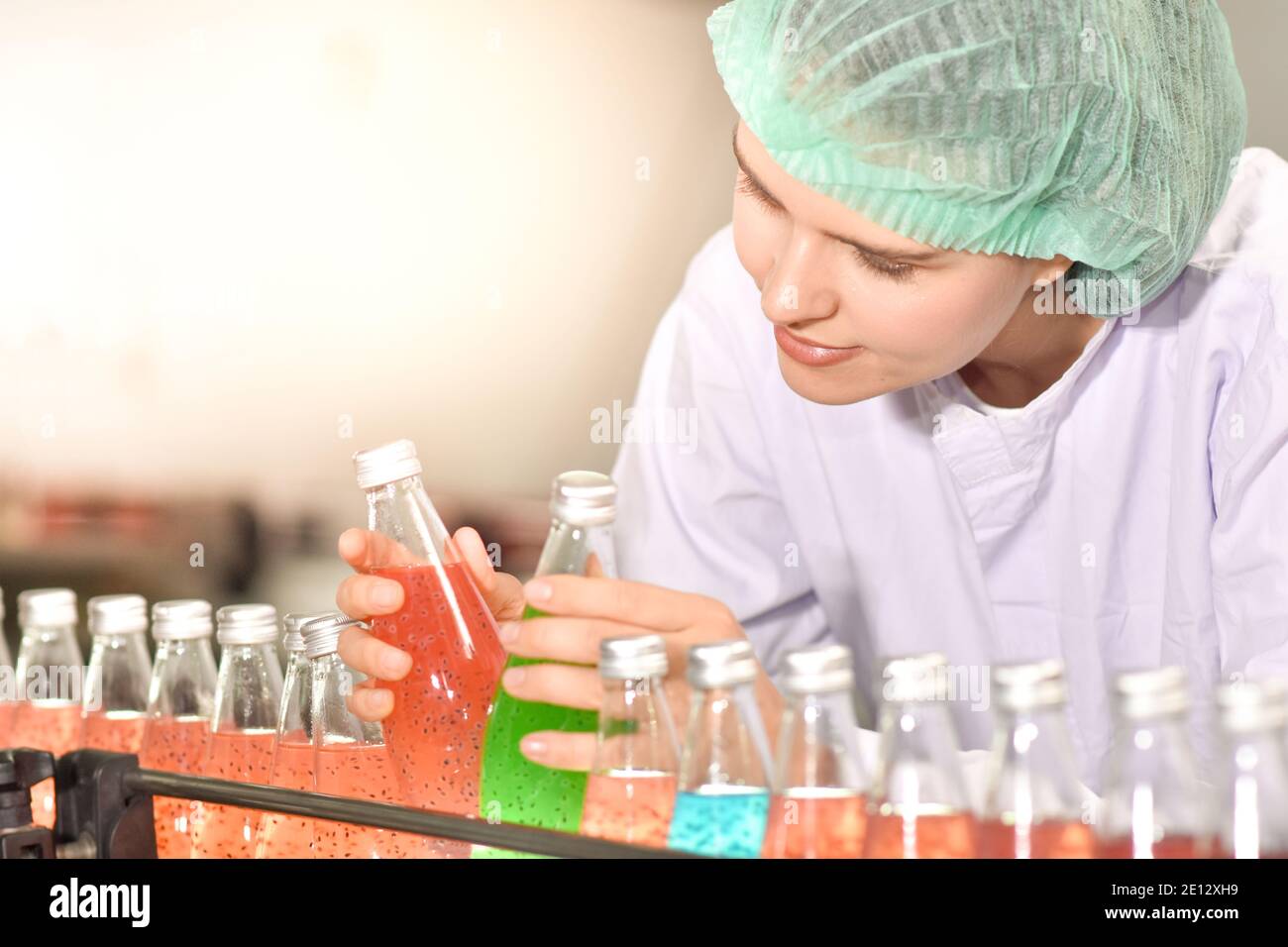 Women inspection quality control in beverage factory Stock Photo - Alamy