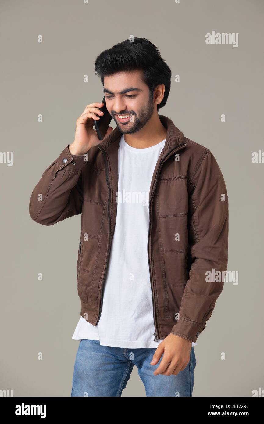 Young indian man standing on hi-res stock photography and images - Alamy