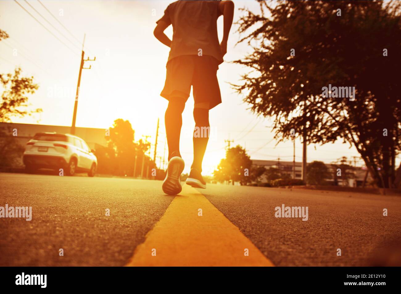 Man running on road hi-res stock photography and images - Alamy