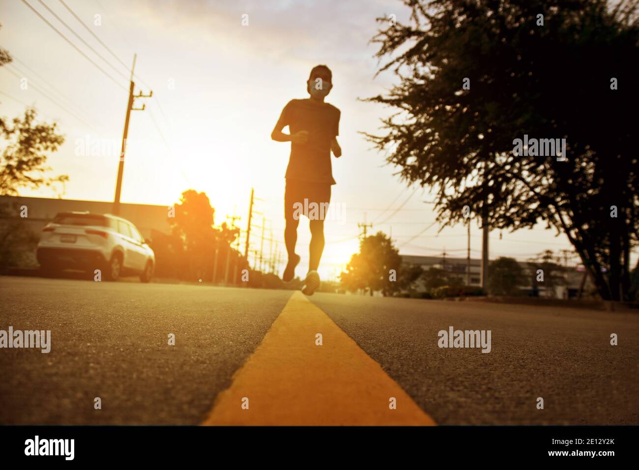 Man running on road hi-res stock photography and images - Alamy
