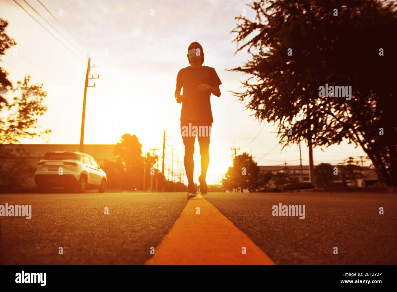 Blurry subject Man running on road Stock Photo - Alamy