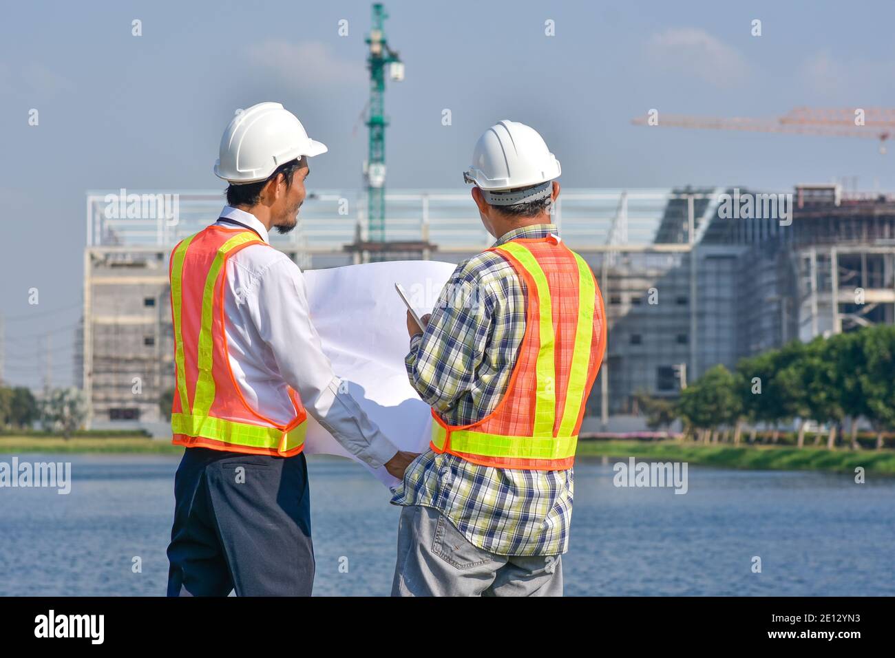 Two Engineer survey location for project building construction real ...