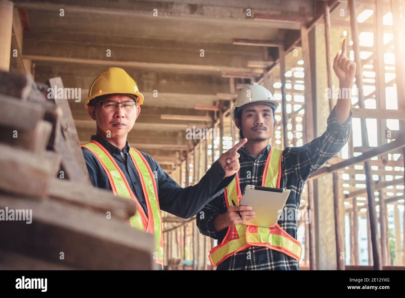 Two Engineer inspection on site building construction to control ...