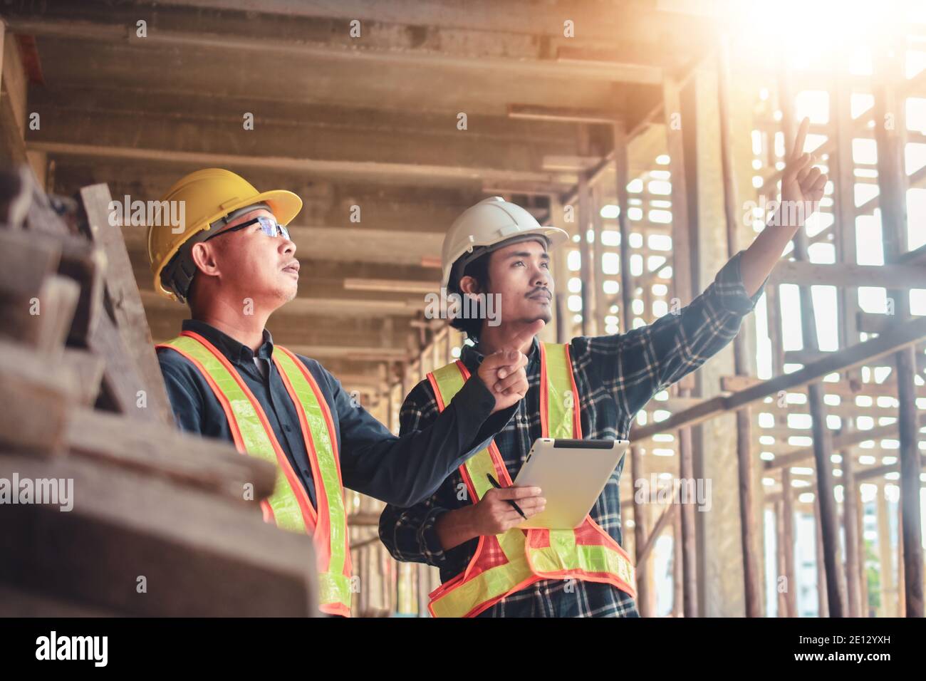 Two Engineer inspection on site building construction to control ...