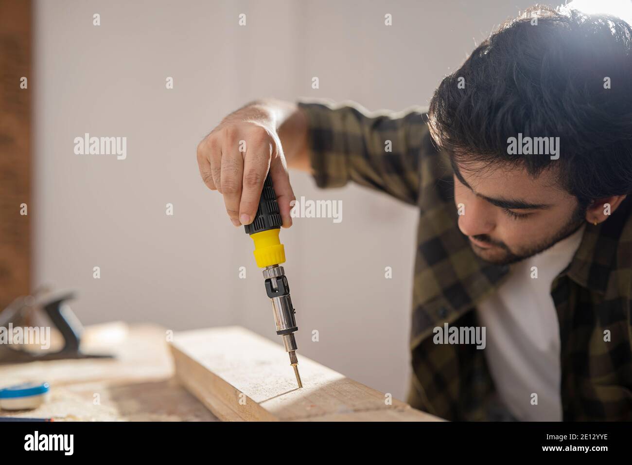Dedicated young man using hi-res stock photography and images - Alamy