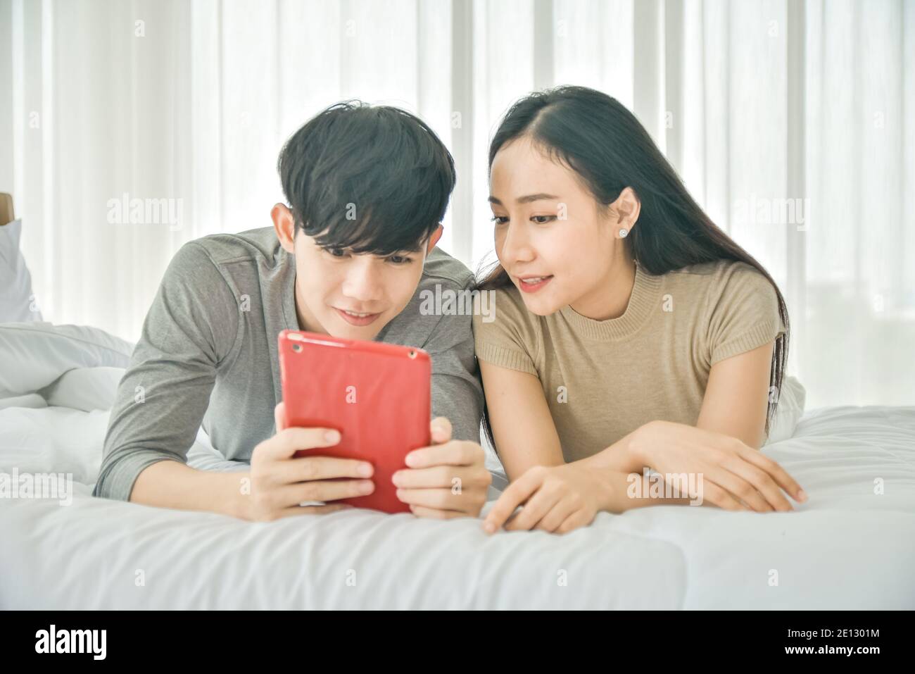 Happy cheerful asian family using hi-res stock photography and images - Alamy