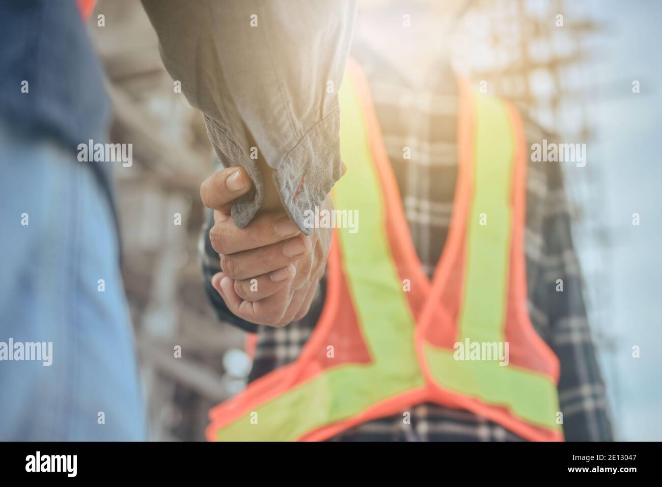 Business people shake hand on site building real estate project ,Hand ...