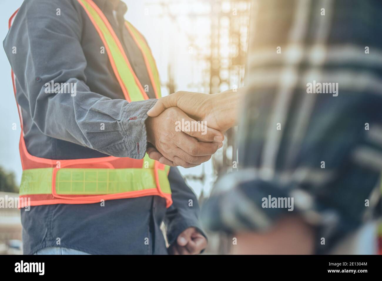 Business people shake hand on site building real estate project ,Hand ...