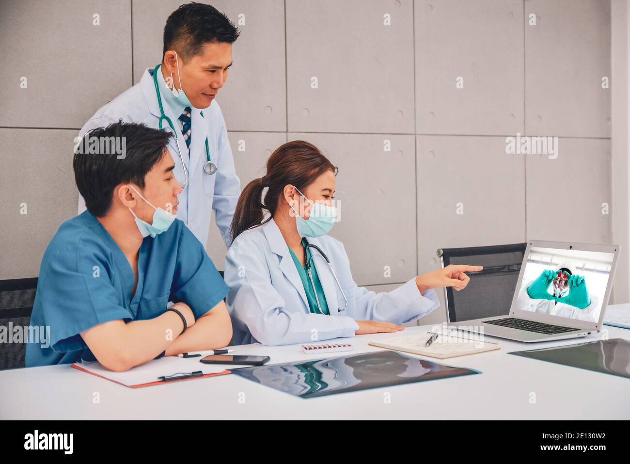 Team doctor meeting online by computer technology medicine in hospital ...