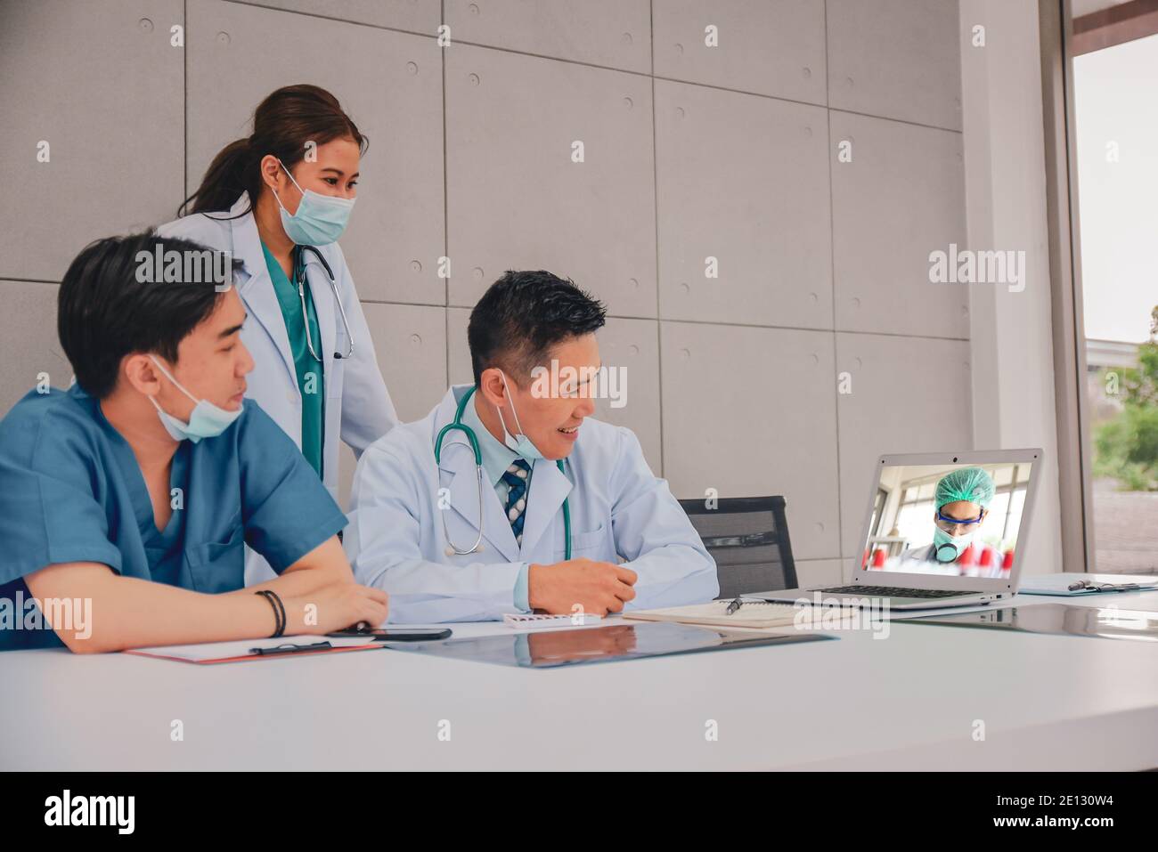 Team doctor meeting online by computer technology medicine in hospital ...