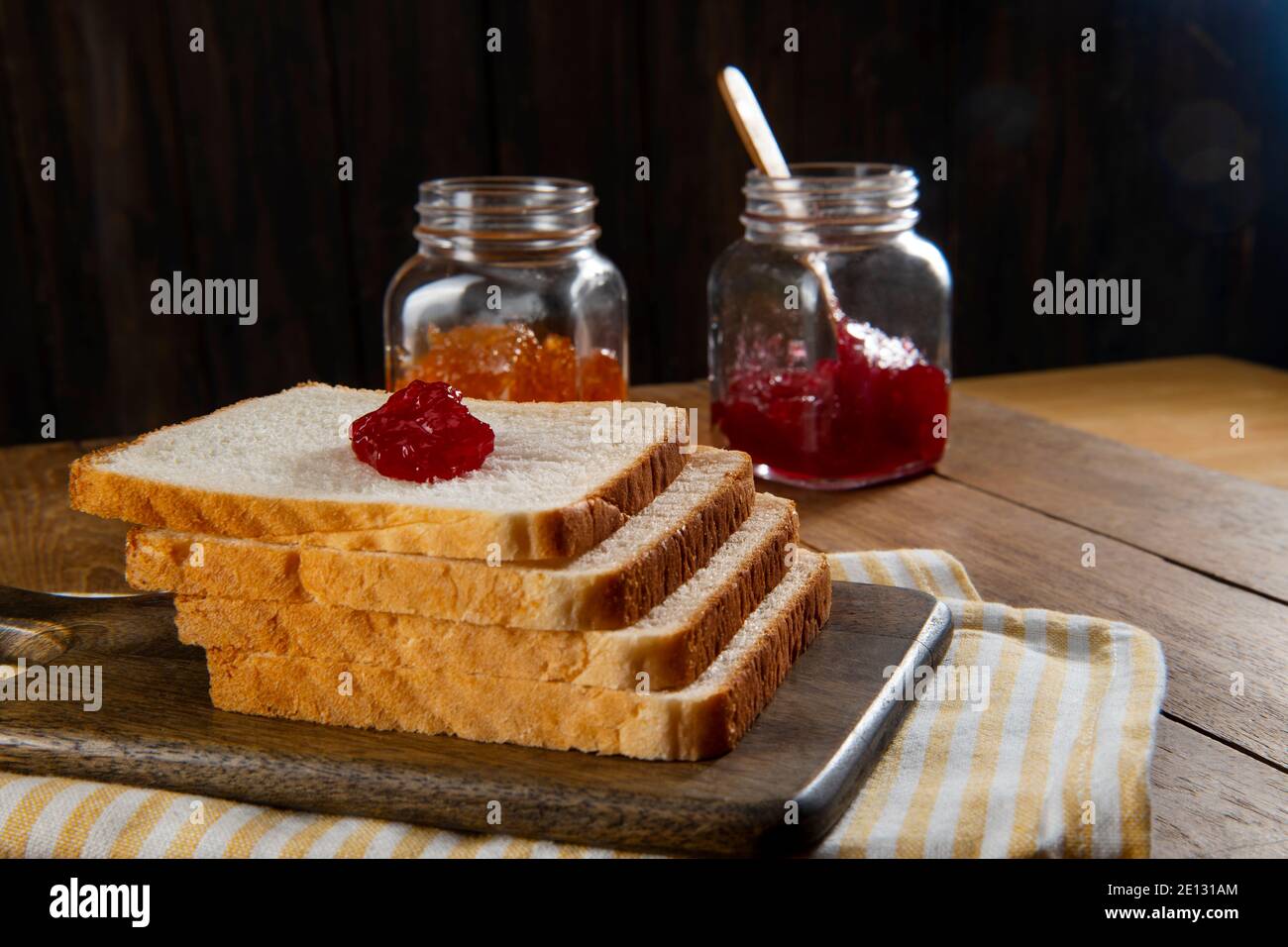 Slices of White bread with strawberry jam Stock Photo - Alamy