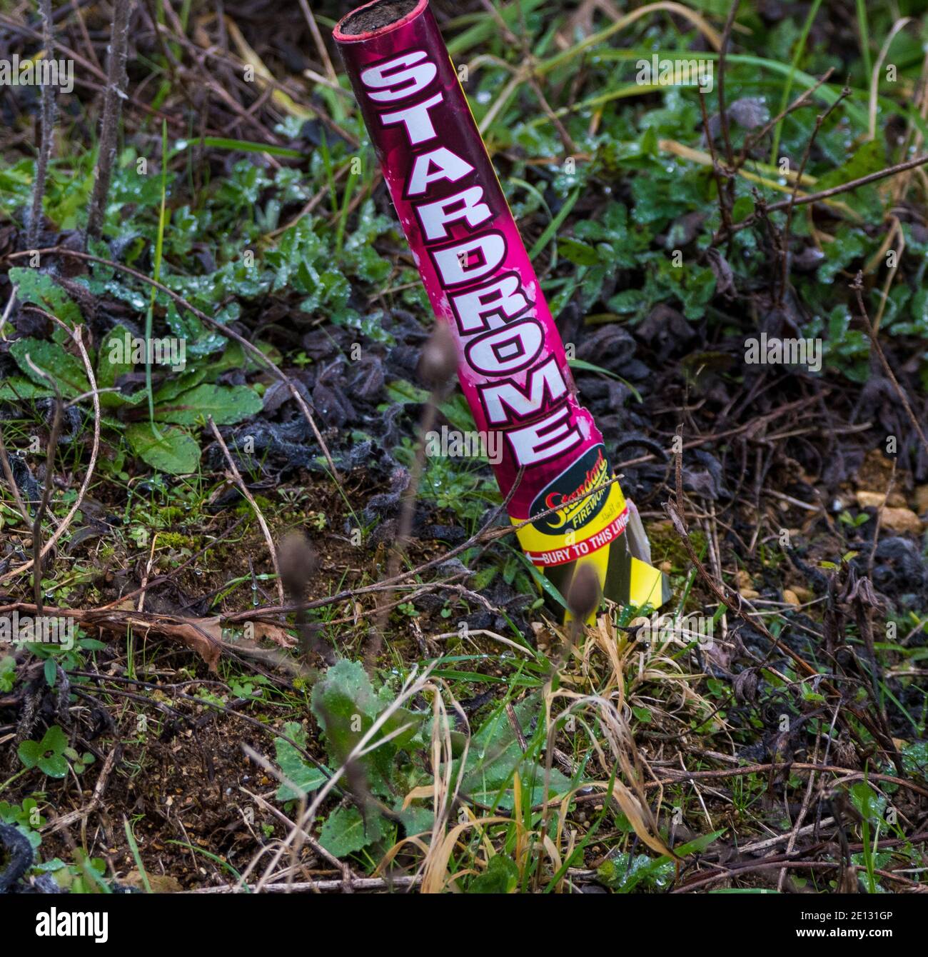 Discraded firework paraphernalia in green grass Stock Photo - Alamy
