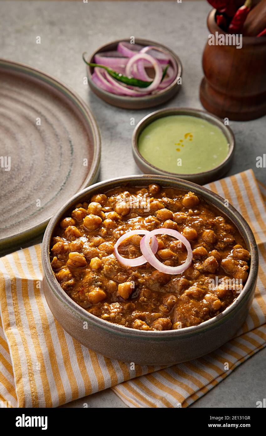 GARNISHED CHOLE CURRY SERVED HOT IN A KADHAI Stock Photo - Alamy