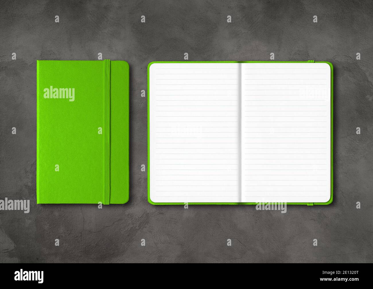 Green closed and open lined notebooks mockup isolated on dark concrete ...