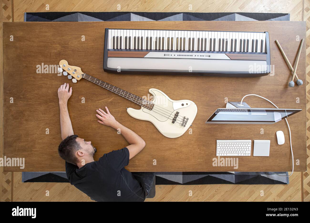 Top view composition with musical instruments on a large wooden table ...