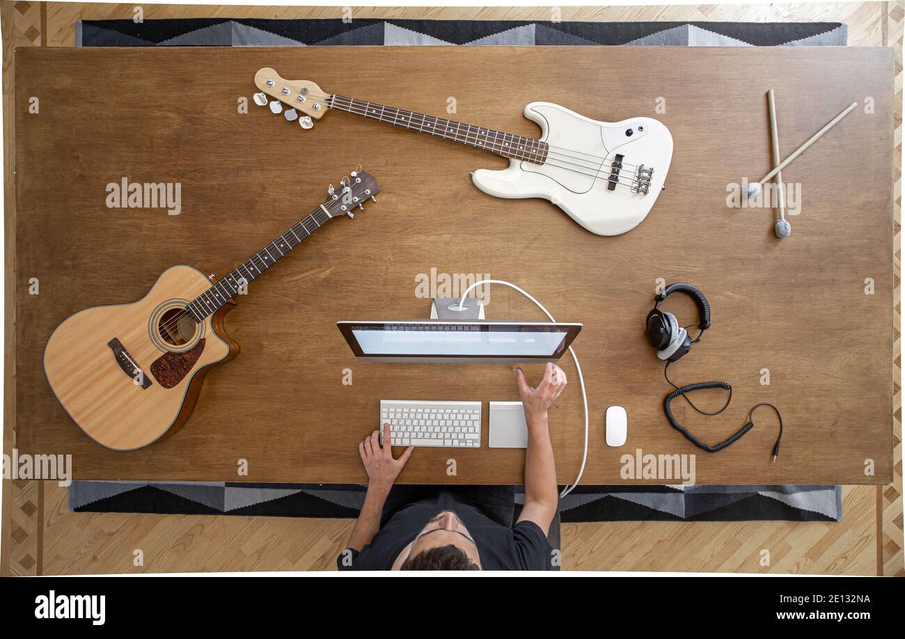 Top view of a composition of musical instruments on a wooden table in a ...