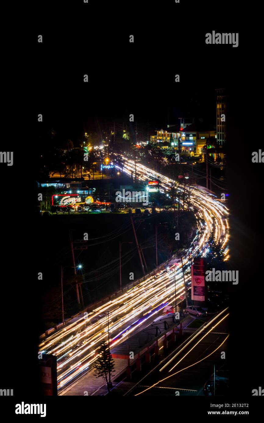 heavy traffic passing on a one-way road at night in tagaytay ...