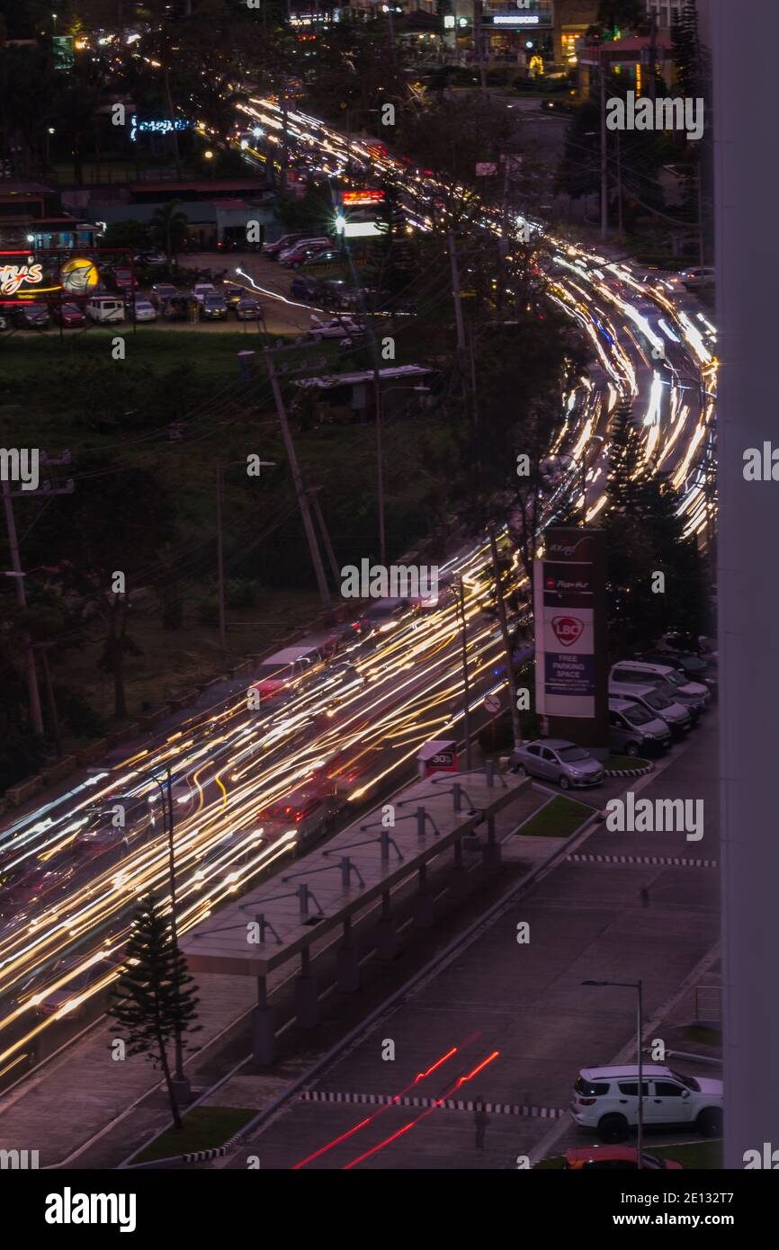 heavy traffic passing on a one-way road at night in tagaytay ...