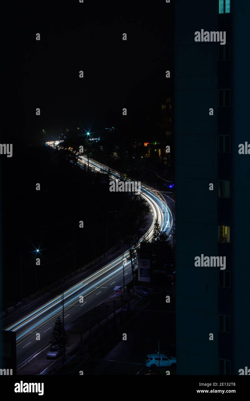 heavy traffic passing on a one-way road at night in tagaytay ...