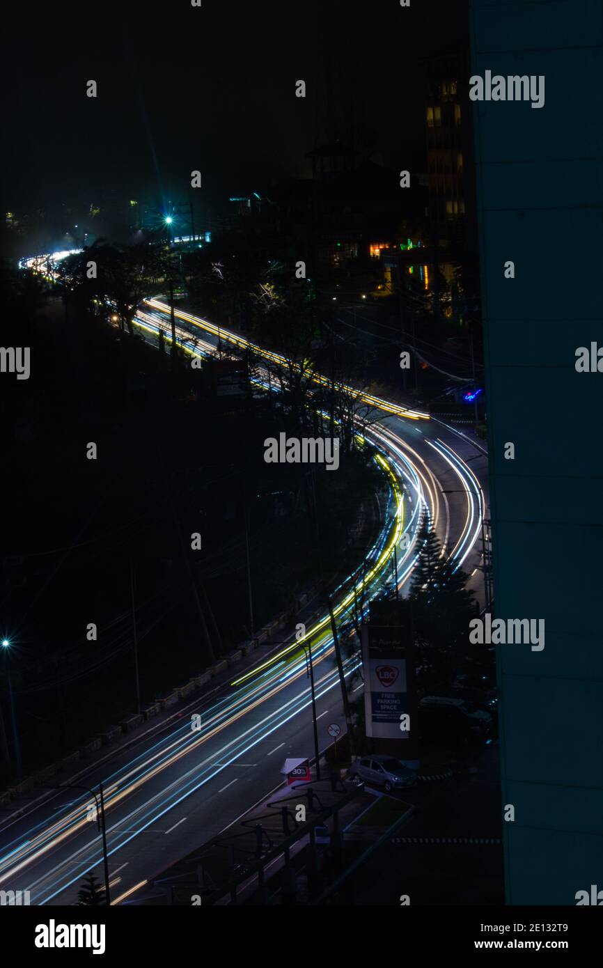 heavy traffic passing on a one-way road at night in tagaytay ...