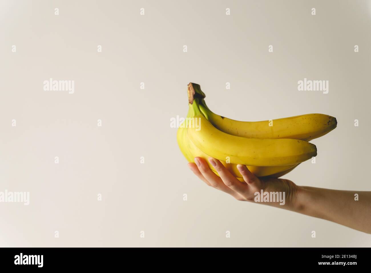 Hand of bananas hi-res stock photography and images - Alamy