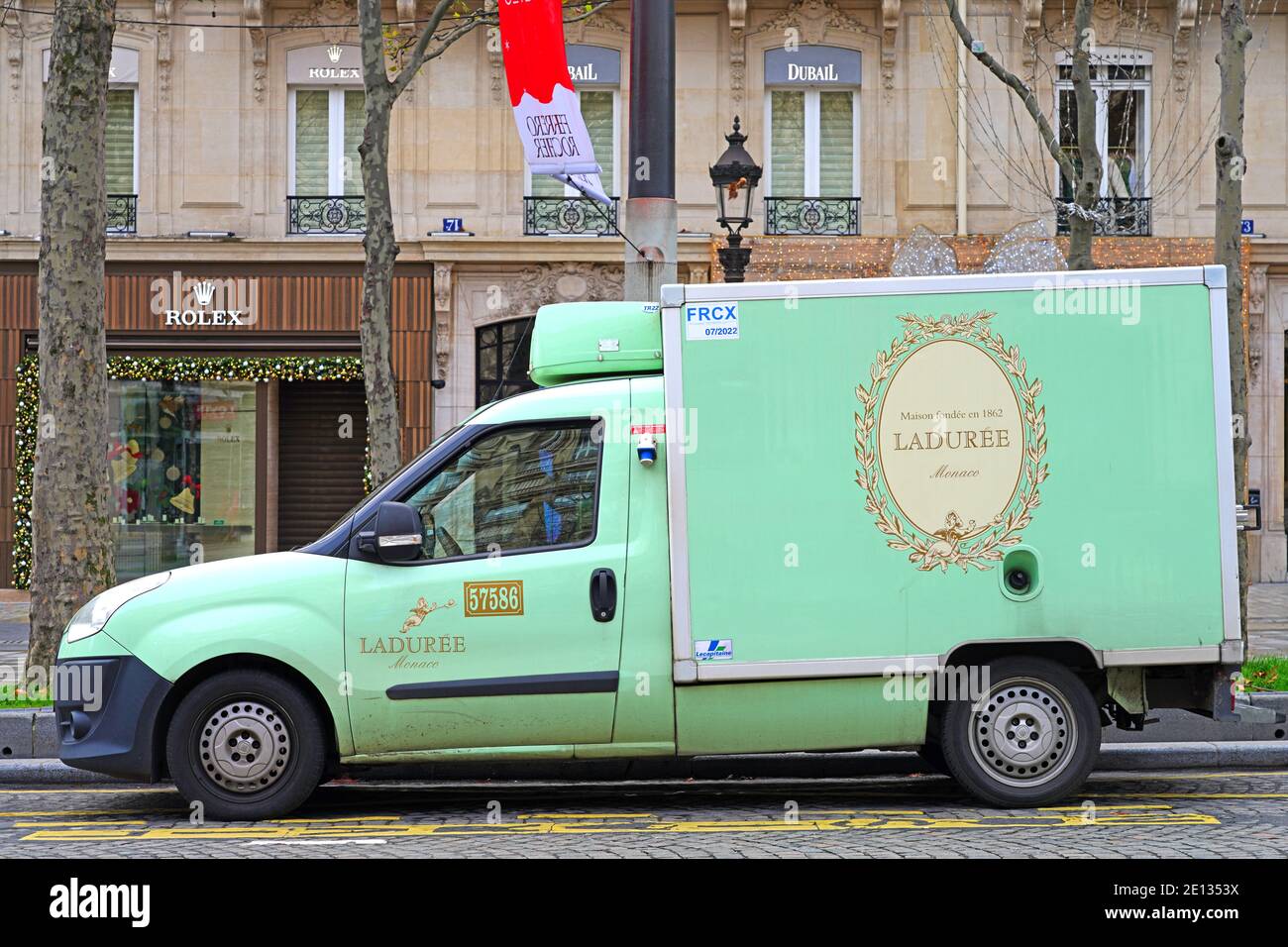 PARIS, FRANCE -25 DEC 2020- View of a green Laduree macaron delivery ...
