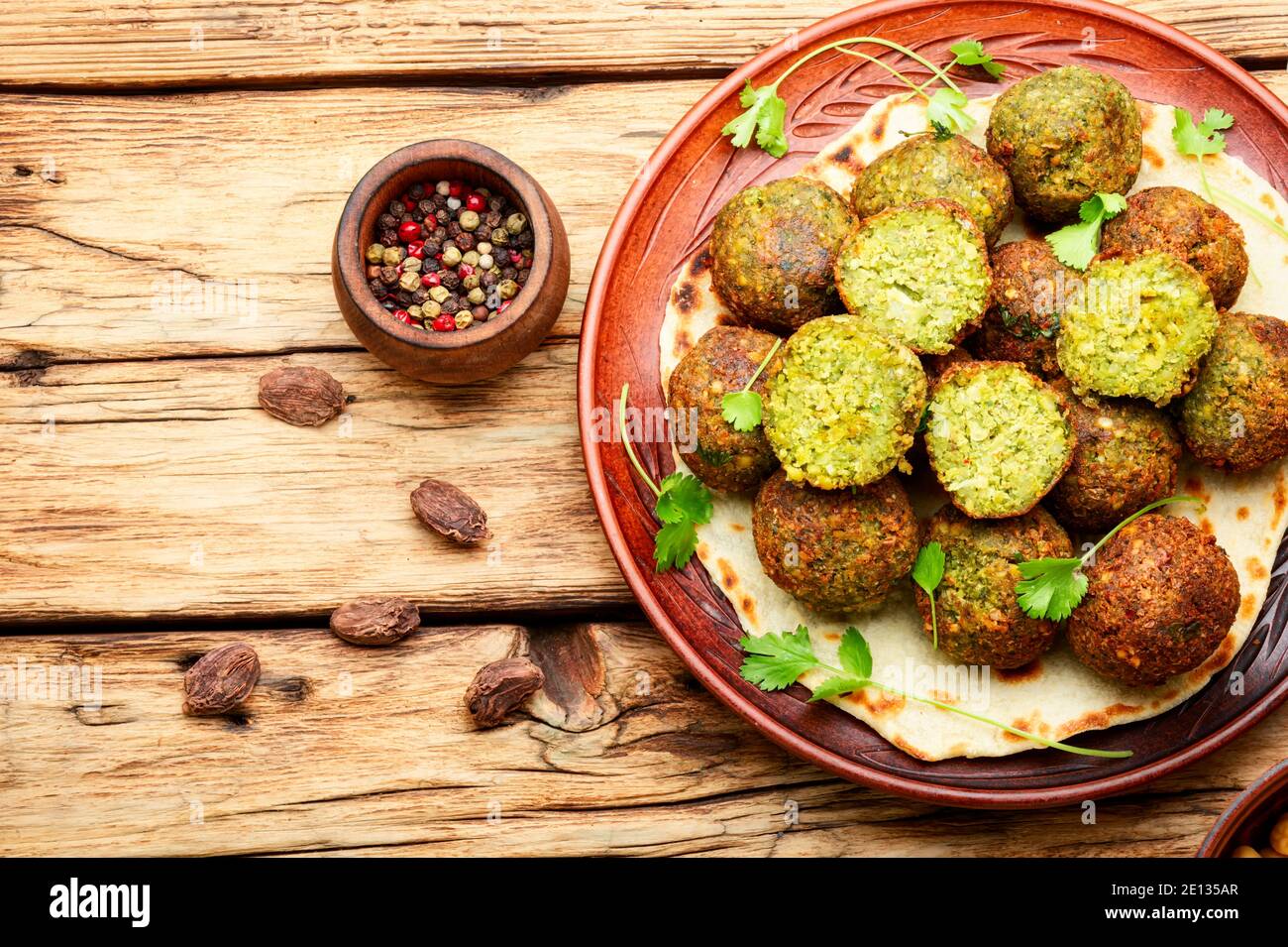 Falafel deep-fried balls made from chopped legumes or chickpeas Stock ...