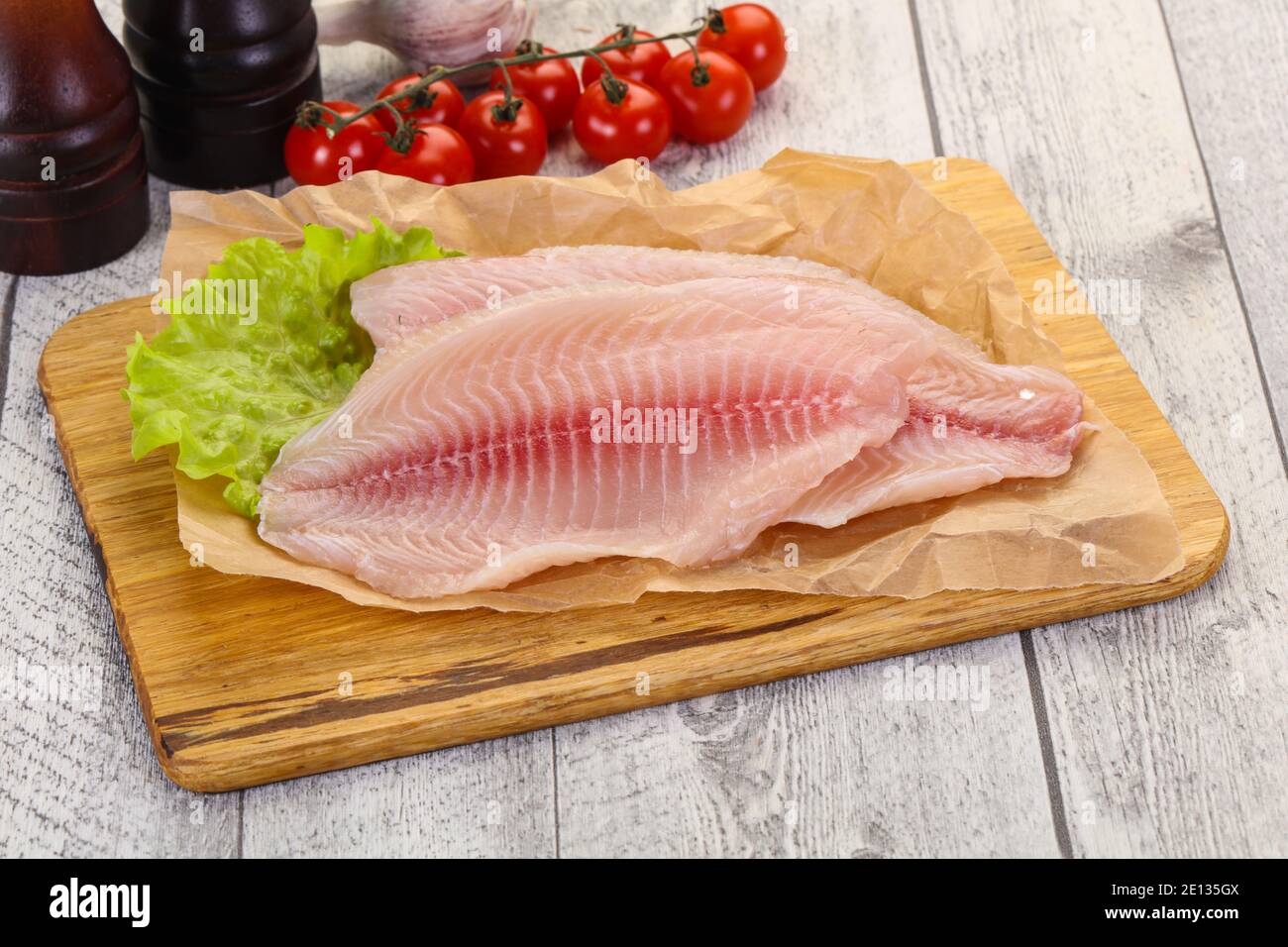 Raw tilapia fish ready for cooking Stock Photo - Alamy