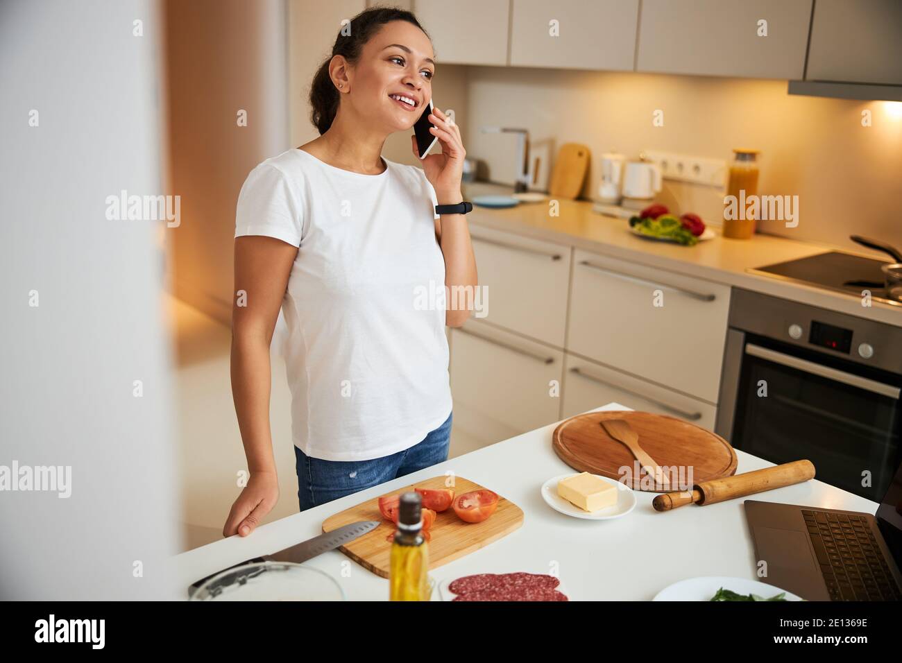 Consulting best friend before following her recipe Stock Photo - Alamy