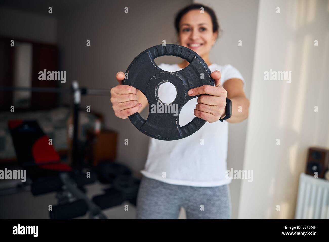 Joyful bodybuilder doing a strength training exercise Stock Photo - Alamy