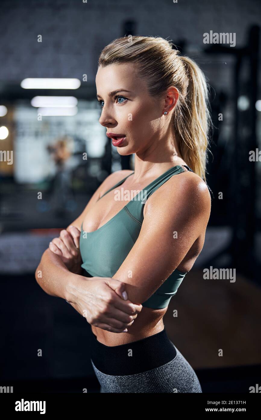 Athletic woman crossing arms hi-res stock photography and images - Alamy