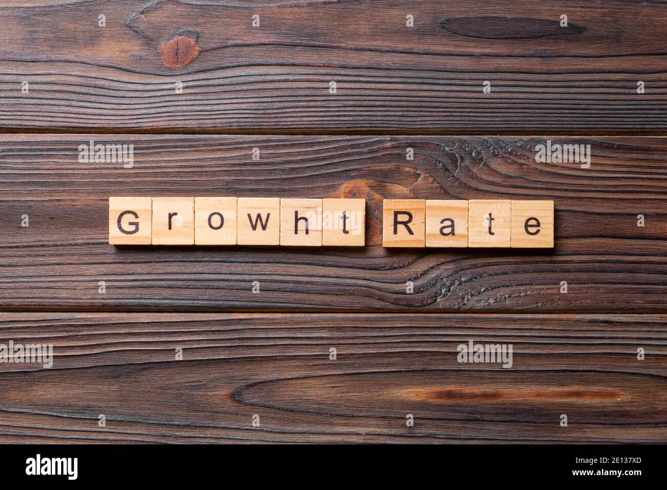 growth rate word written on wood block. growth rate text on cement ...