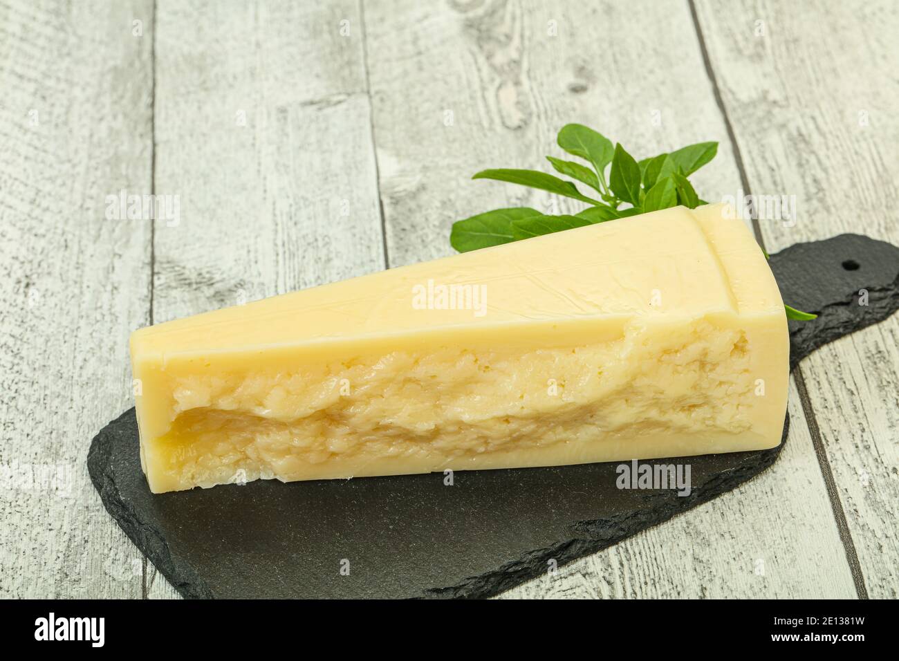Hard parmesan cheese served basil leaves Stock Photo - Alamy