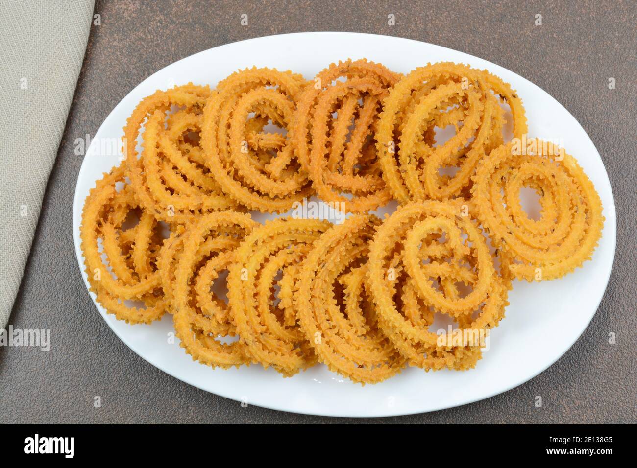 Murukku is a popular south indian savory and crunchy snack prepared ...