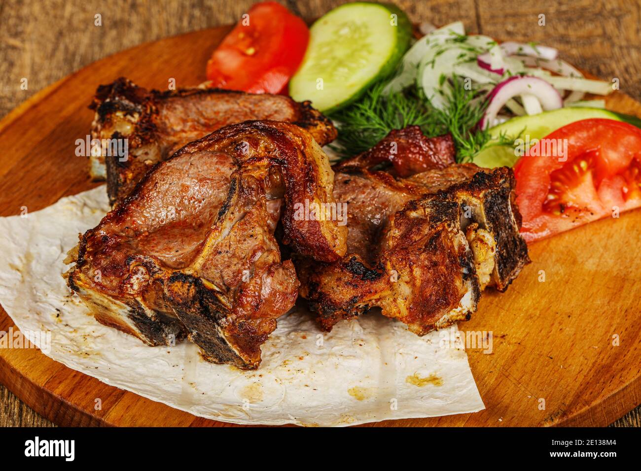 Grilled lamb barbeque served vegetables and onion Stock Photo - Alamy