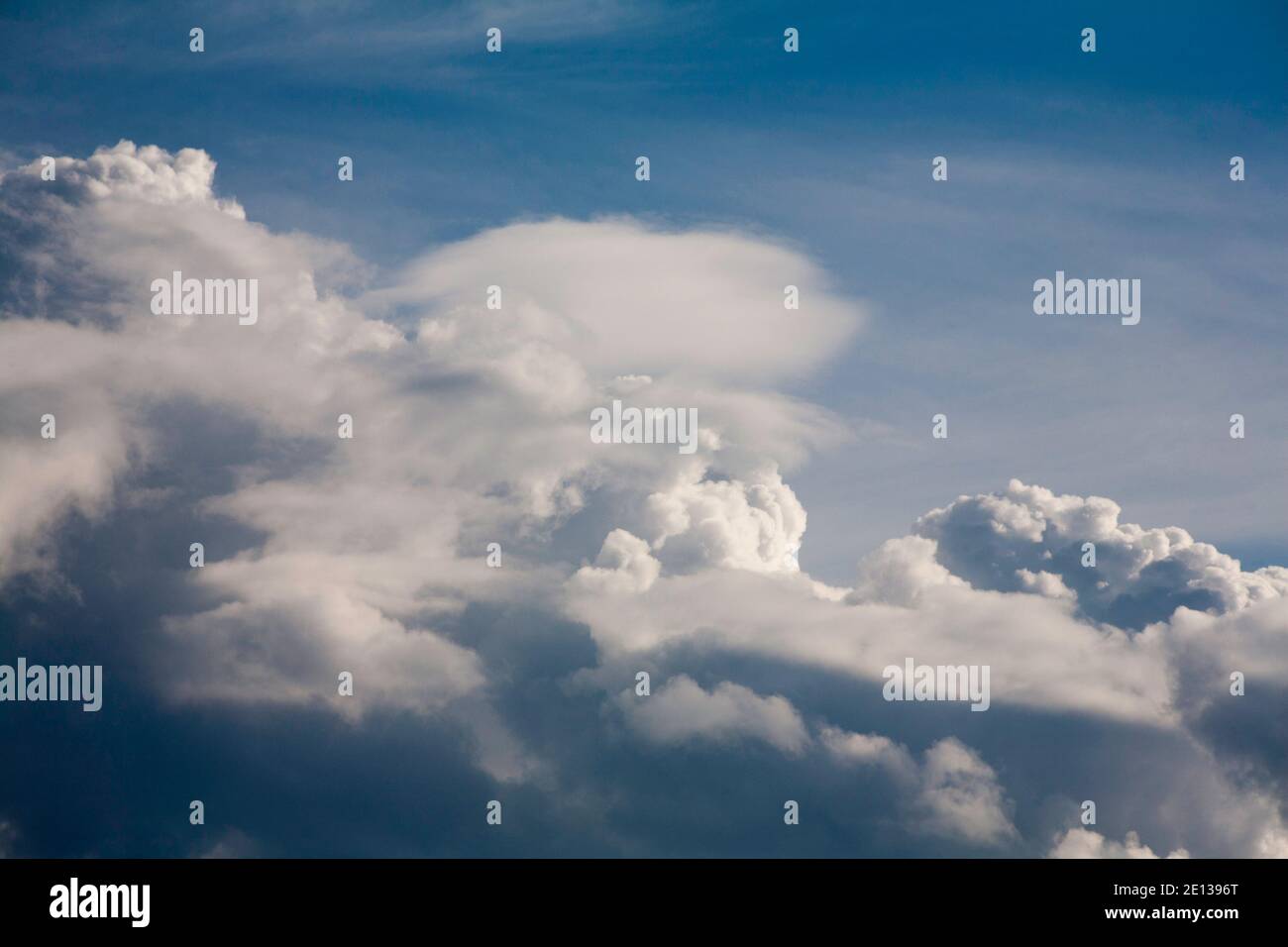 Cumulus cloud passing across Cheshire on a spring afternoon England ...
