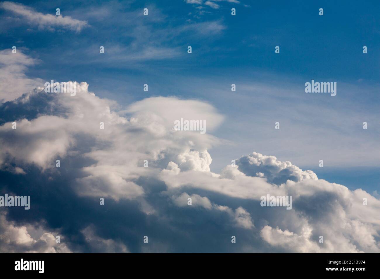 Cumulus cloud passing across Cheshire on a spring afternoon England ...