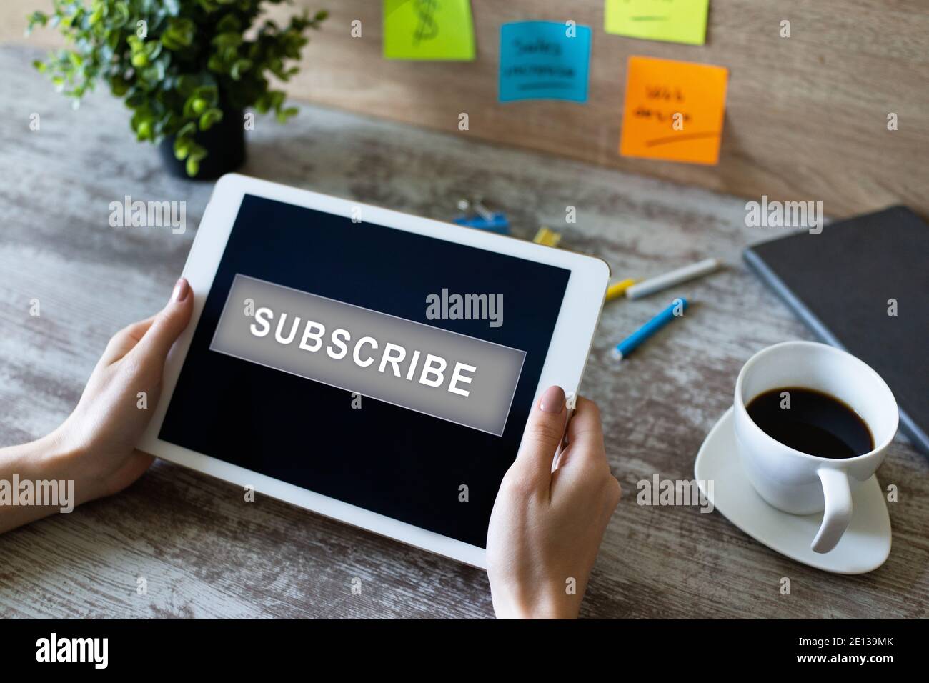 Subscribe button on device screen. Internet and digital marketing ...