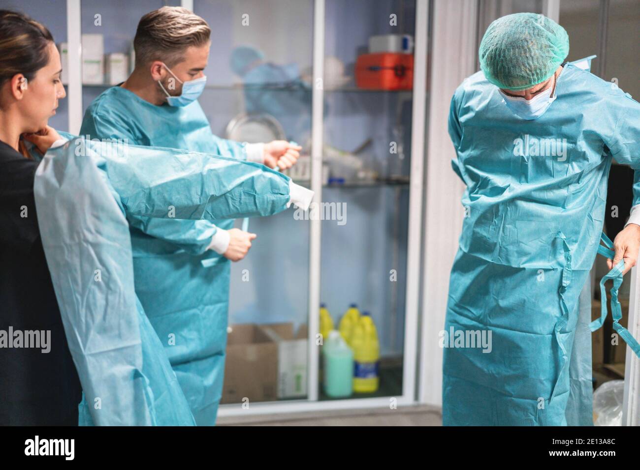 Medical doctors and nurse preparing for surgical operation in hospital ...