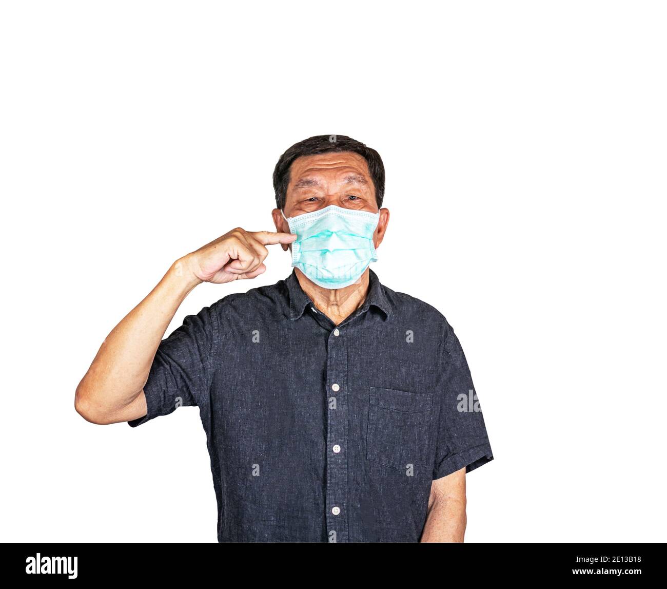 Asian Senior man pointing at the face mask, isolated on white ...