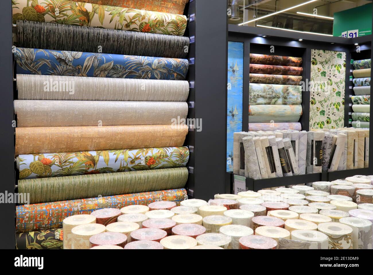 Rolls of vinyl quality wallpaper in a building supermarket, store ...