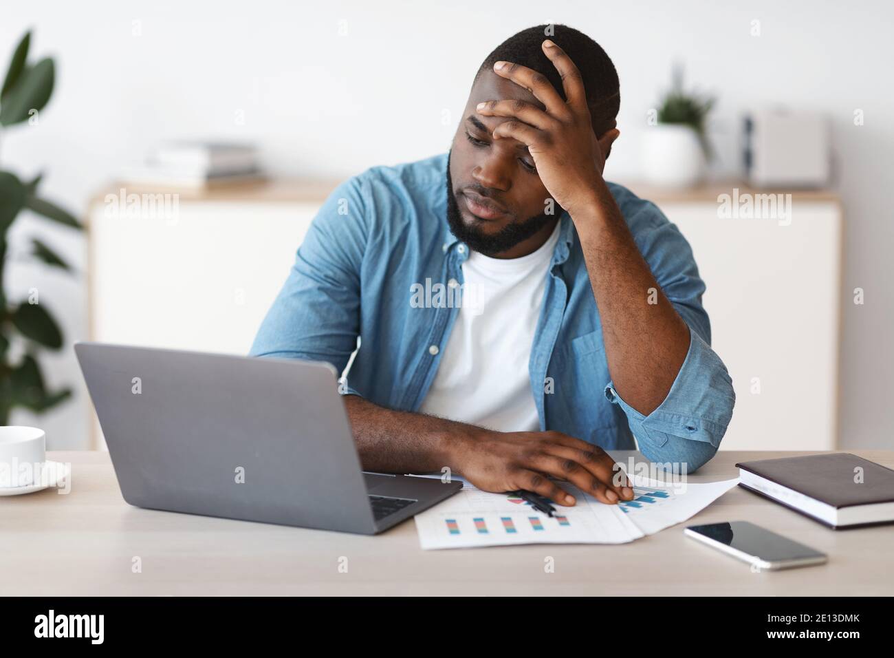 Stressed Man At Desk