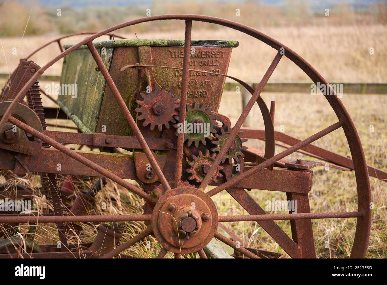 Old farming machinery in field, Somerset Root Seed Drill Stock Photo ...