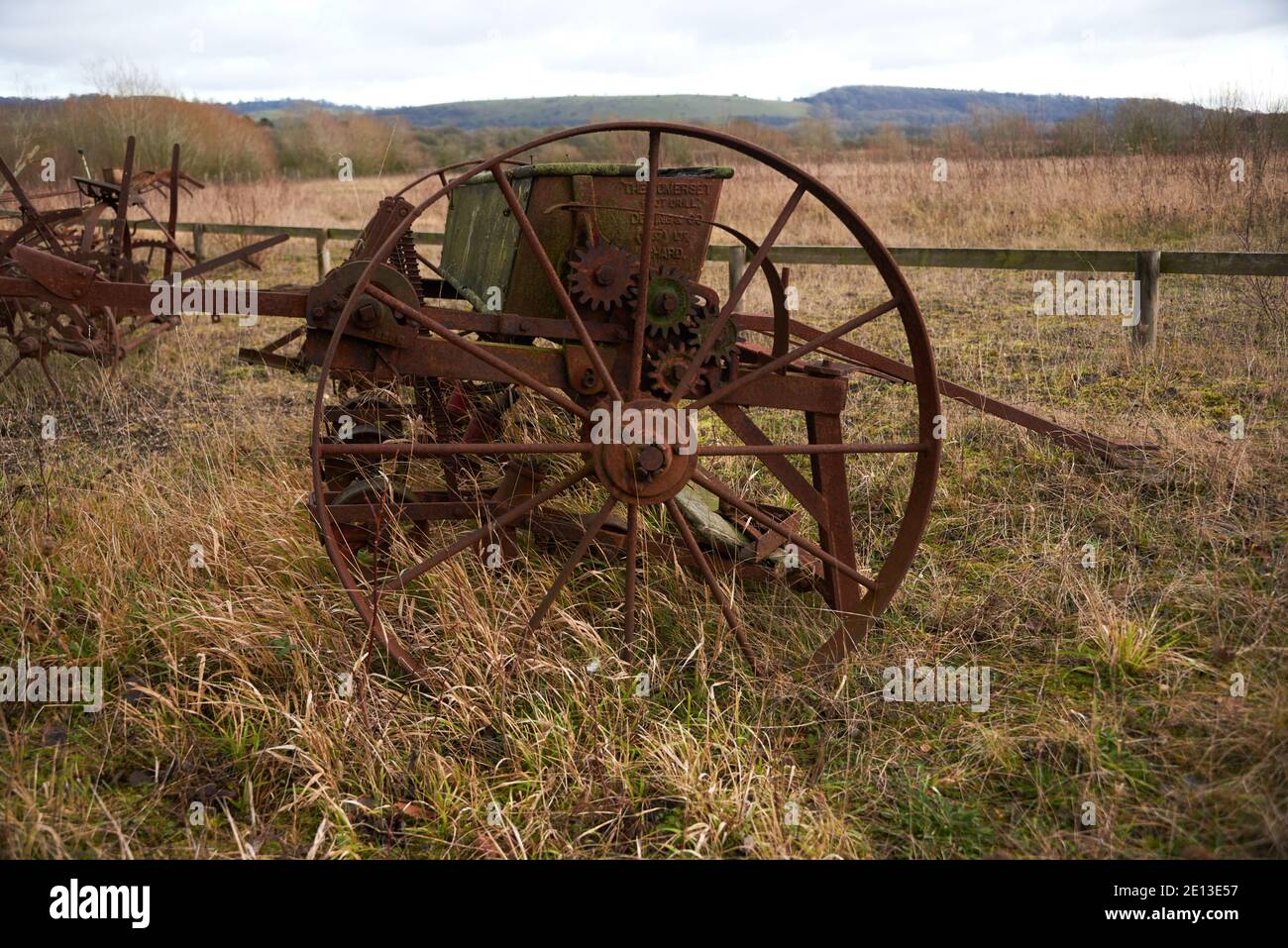 Old farming machinery in field, Somerset Root Seed Drill Stock Photo ...